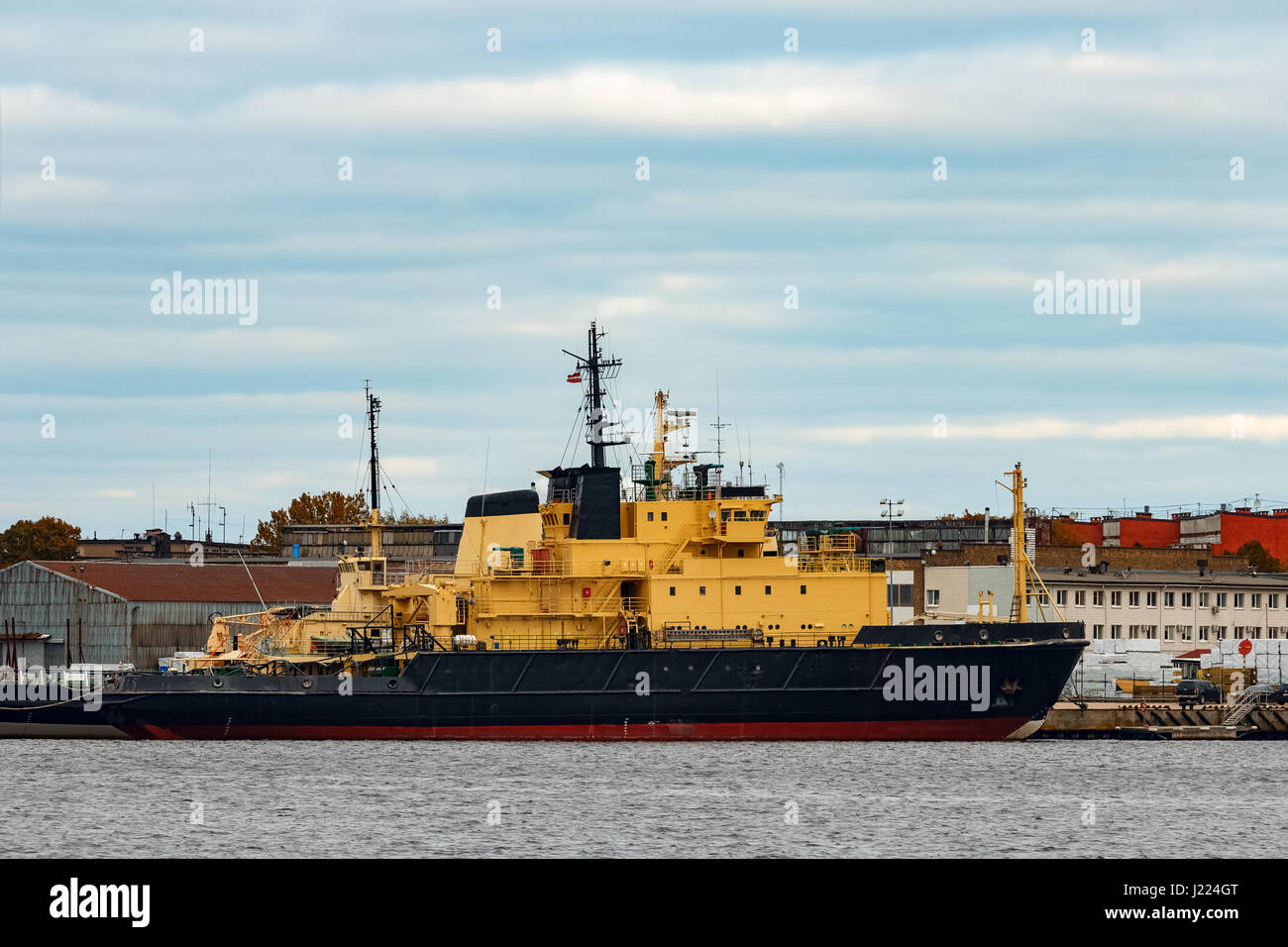 Yellow icebreakers moored at the port of Riga, Europe Stock Photo - Alamy