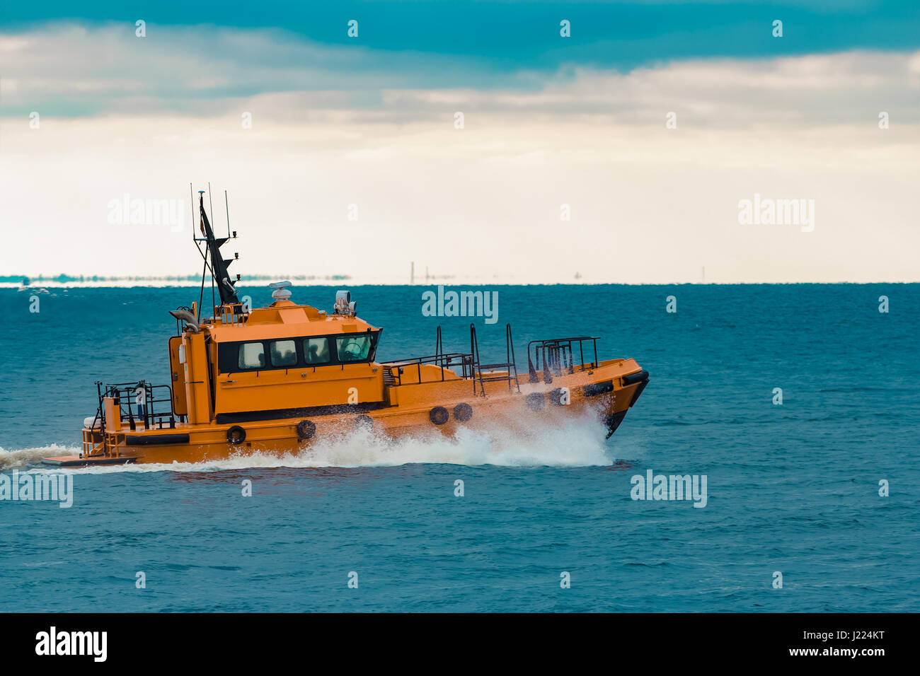 Orange pilot ship moving fast in Baltic sea. Europe Stock Photo - Alamy