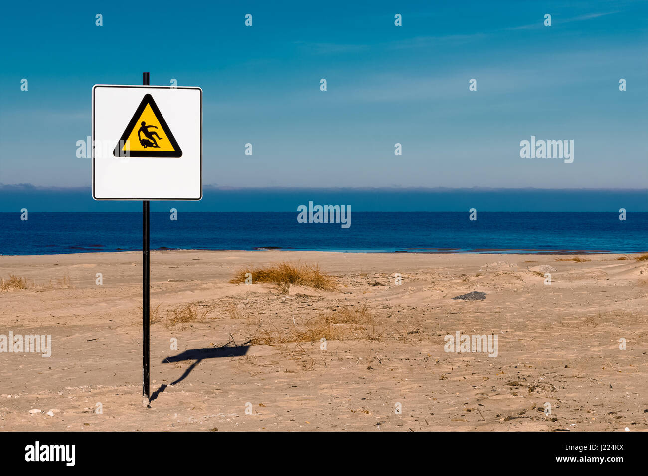 Yellow warning sign on summer beach, Riga Stock Photo - Alamy