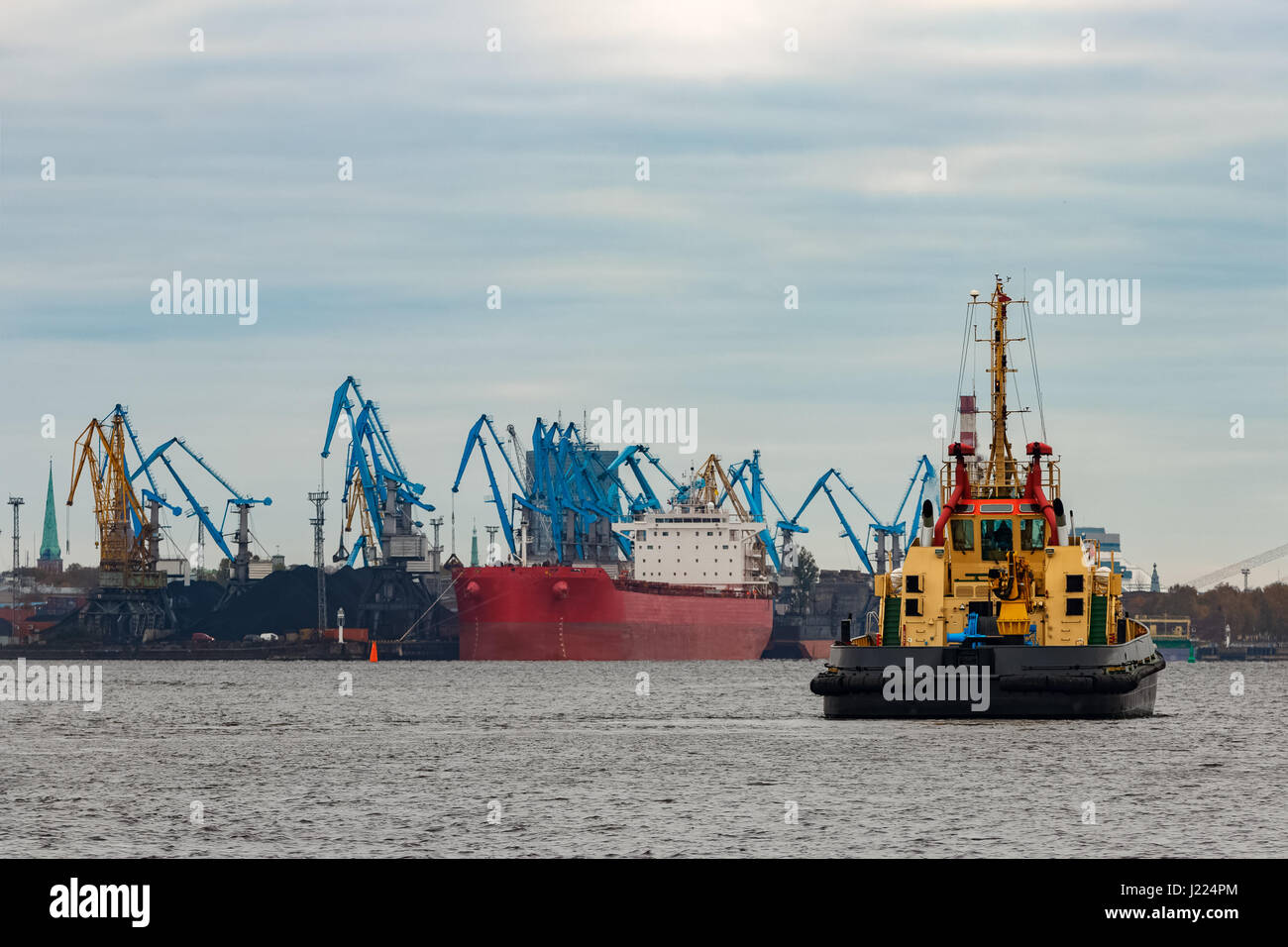 Tug ship in the cargo port of Riga, Europe Stock Photo - Alamy