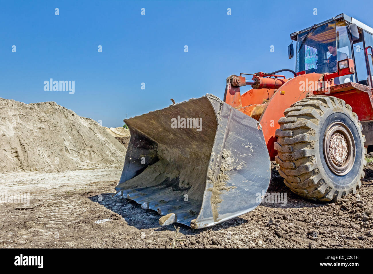 Close up view of red loader's undercarriage on construction site Stock ...