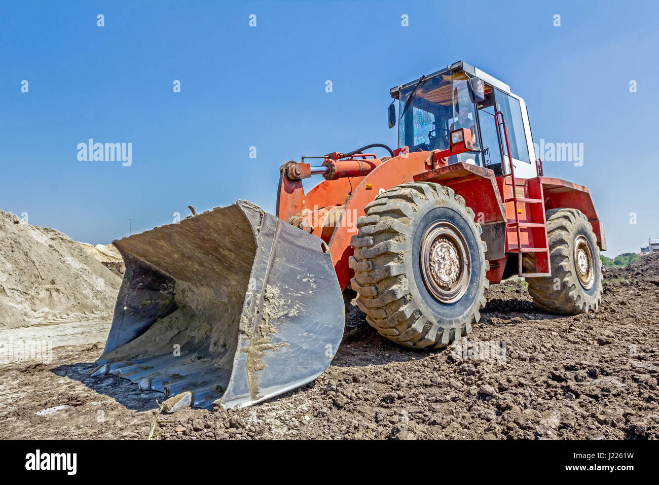 Close up view of red loader's undercarriage on construction site Stock ...