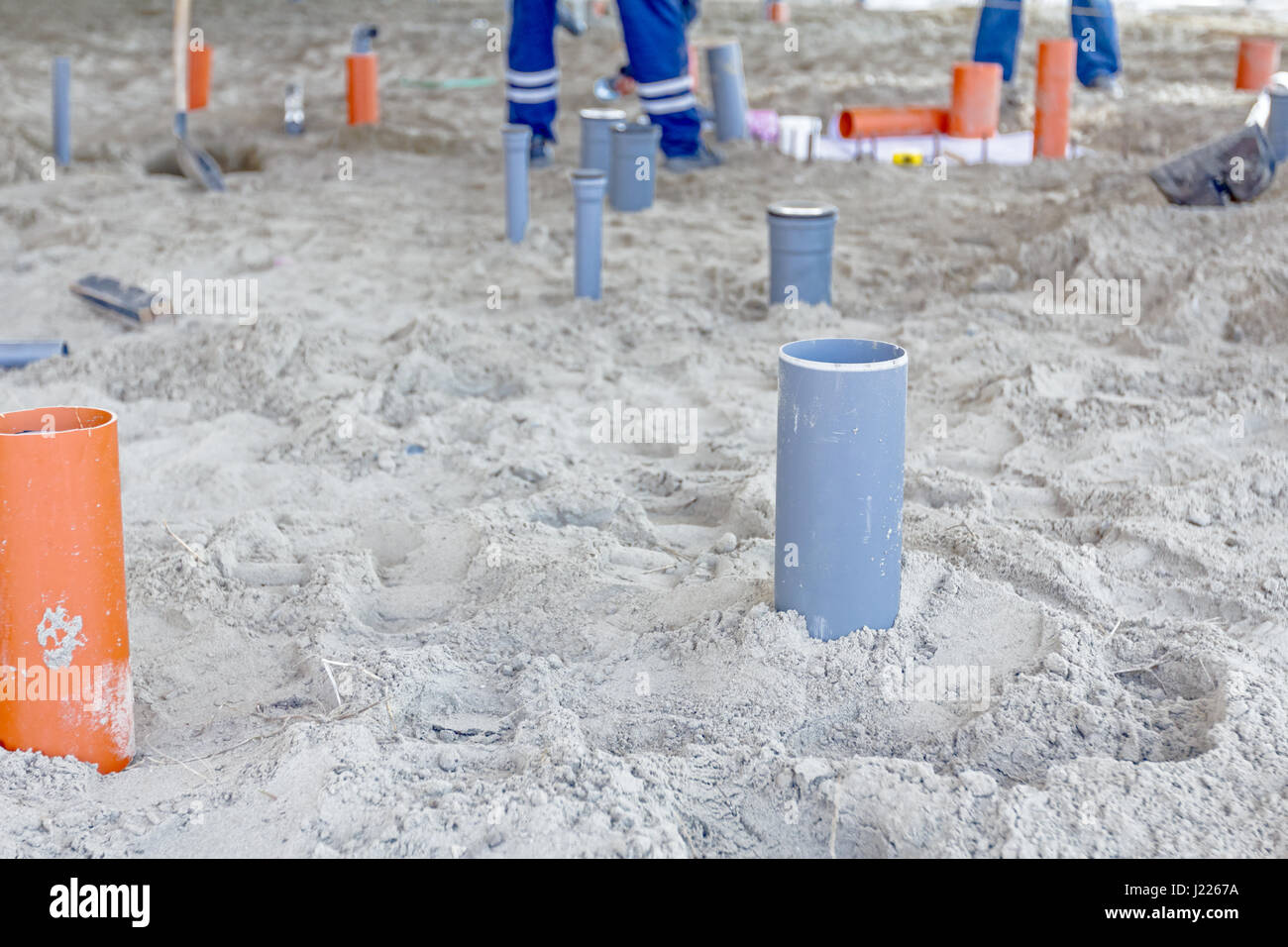 Arranged PVC of water pipes are assembled and lined up on building site ...