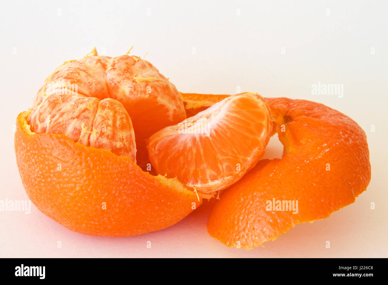 Fresh peeled mandarin Stock Photo - Alamy