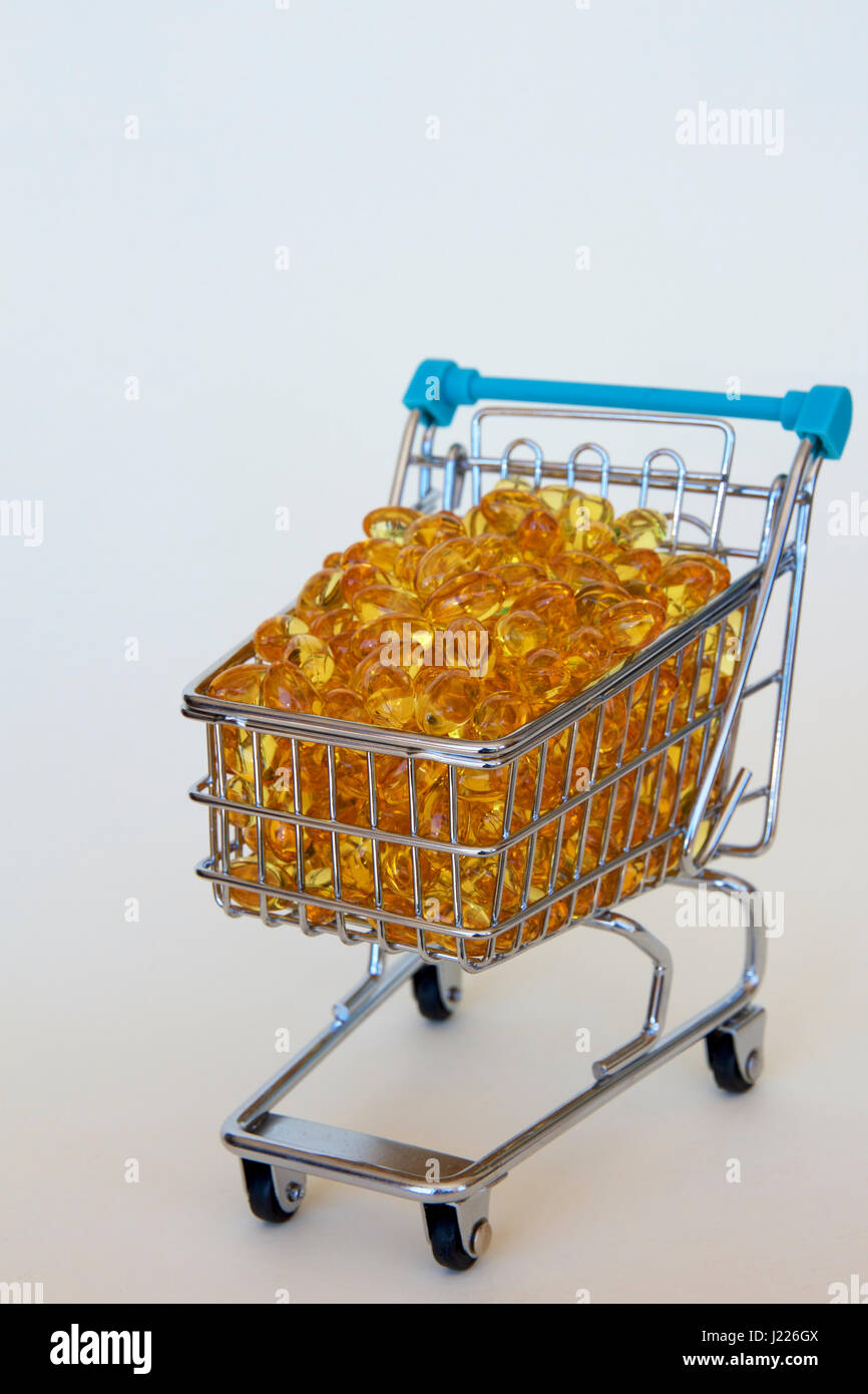 Supermarket trolley laden with fish oil capsules Stock Photo - Alamy