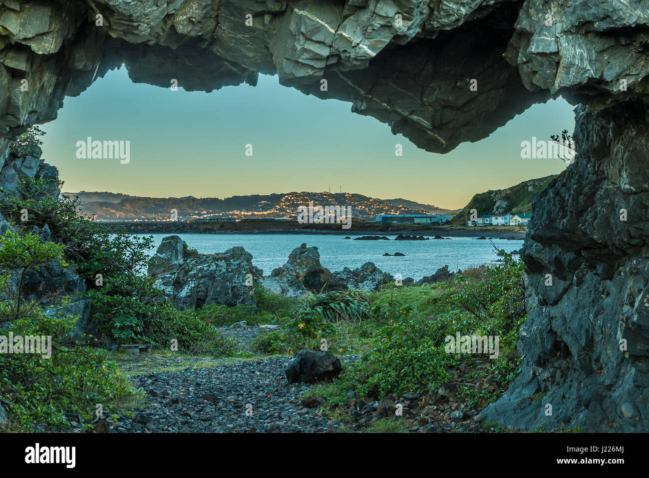 Looking through a hole in rock at Lyall Bay, Wellington, New Zealand ...