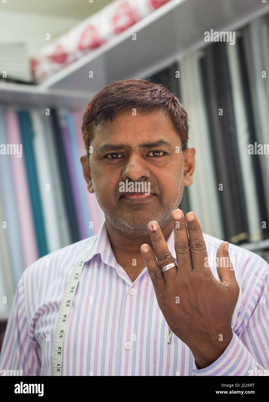 New Delhi - APRIL 23, 2017: New Delhi elections 2017 A man shows his ...