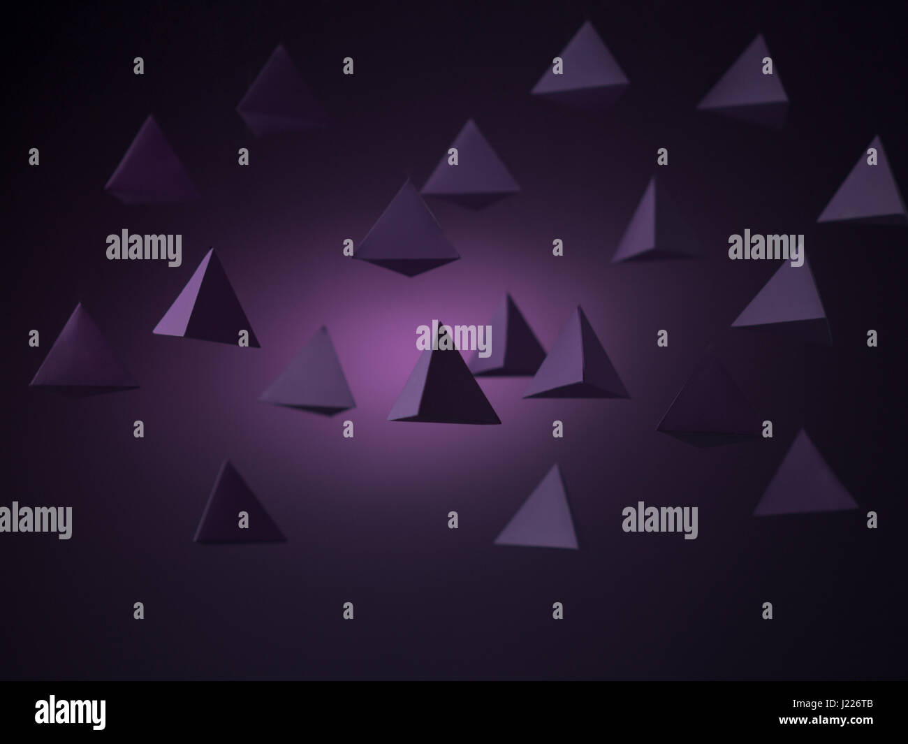 Abstract paper pyramid background in space. Copy space available ...