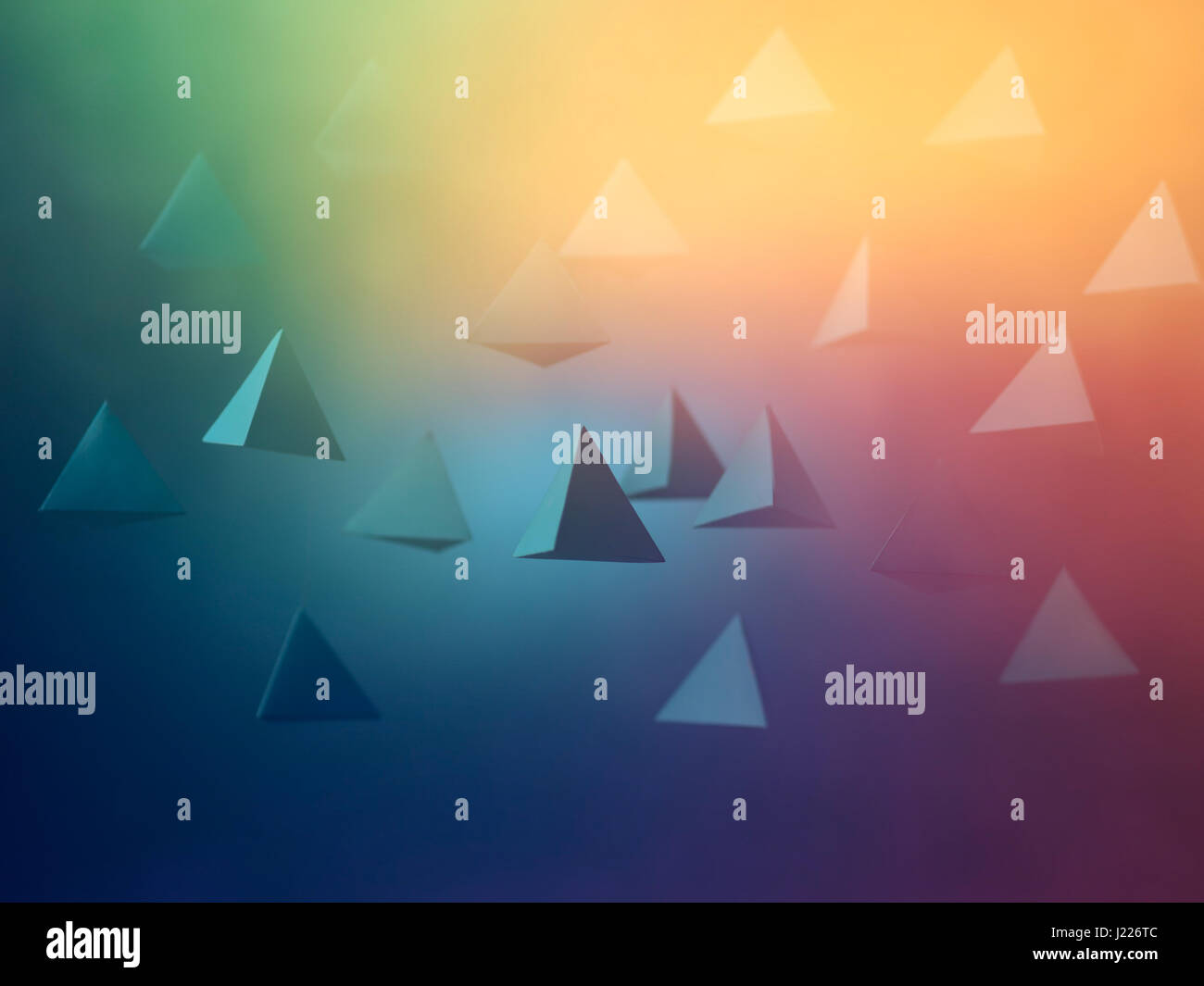 Colorful abstract paper pyramid background in space. Copy space ...