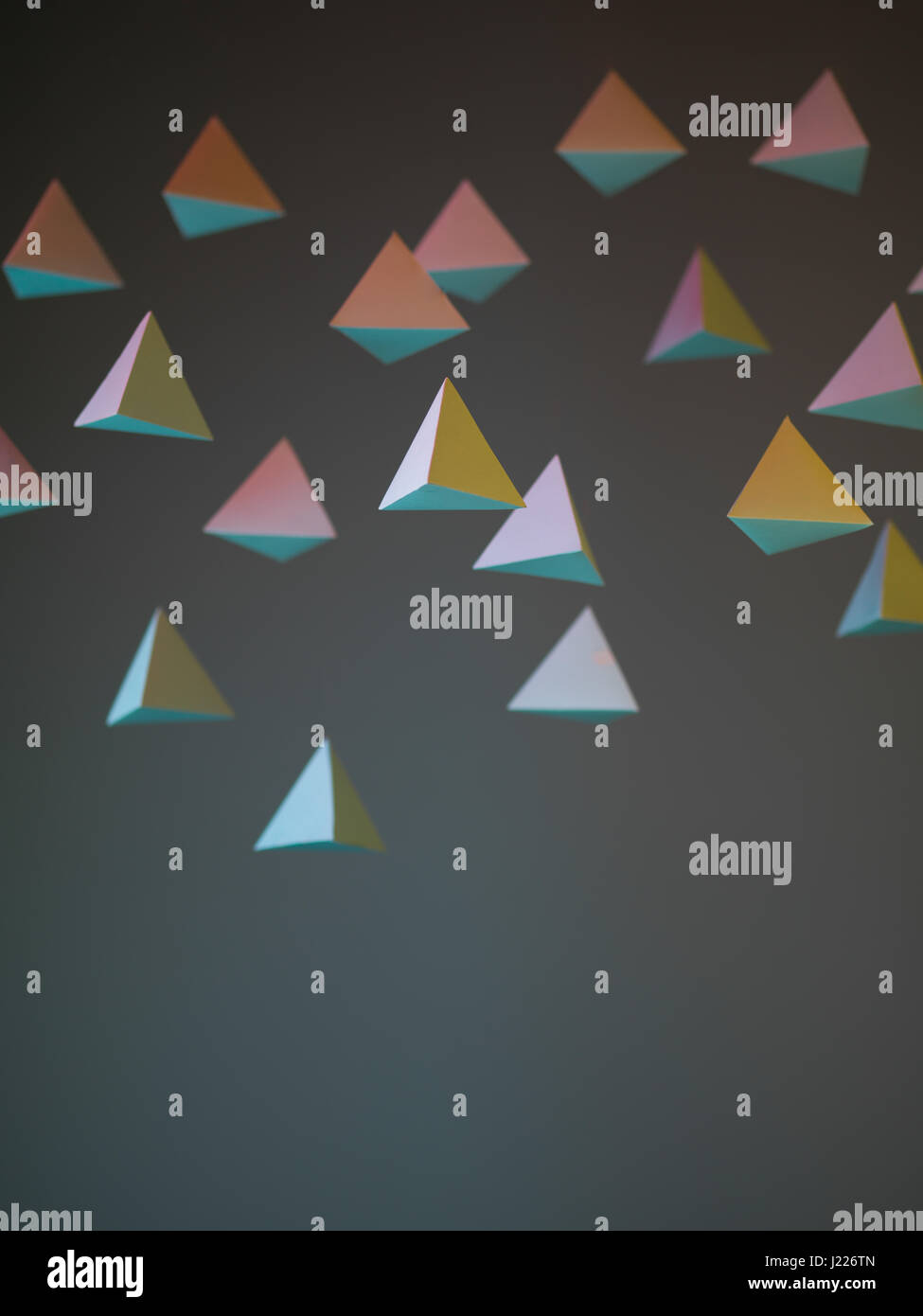 Abstract paper pyramid background in space. Copy space available ...