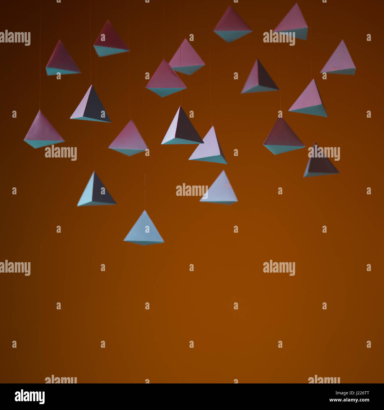 Abstract paper pyramid background in space. Copy space available ...