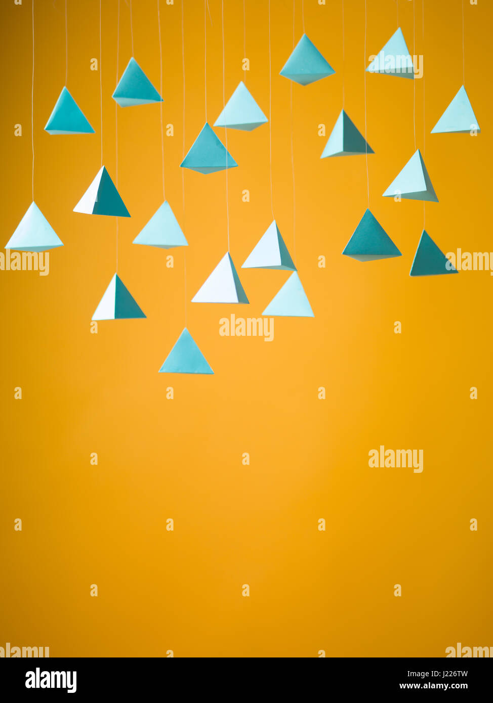 Abstract paper pyramid background in space. Copy space available ...