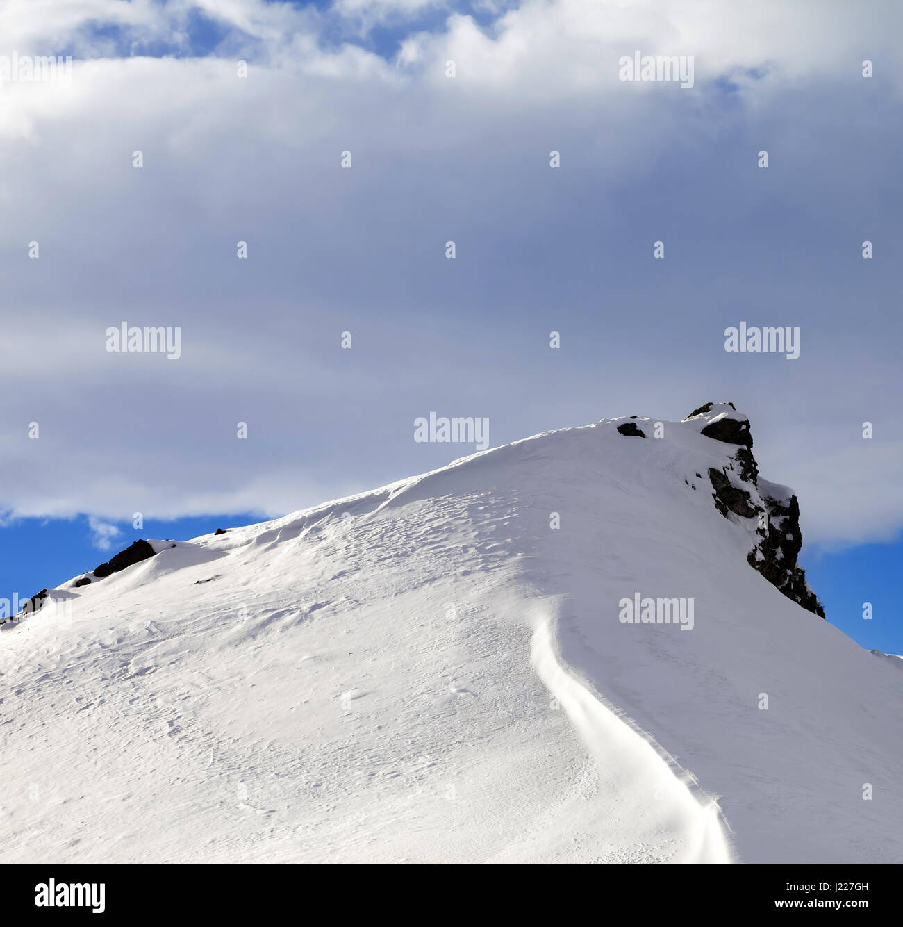Top of mountains with snow cornice after snowfall. Greater Caucasus ...