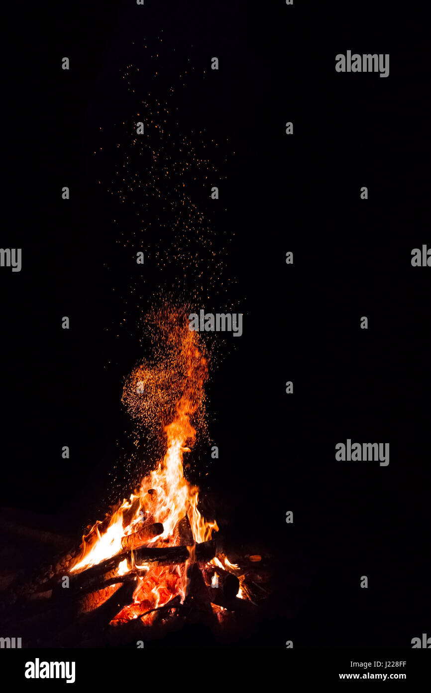 Campfire with flying sparks isolated on black background Stock Photo ...