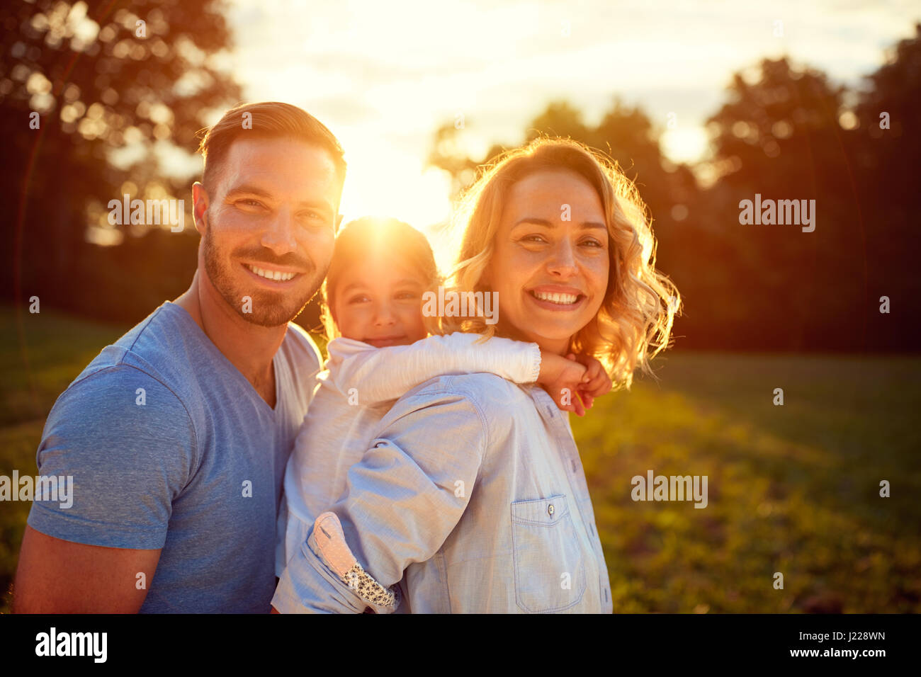 Happy family in nature together Stock Photo - Alamy