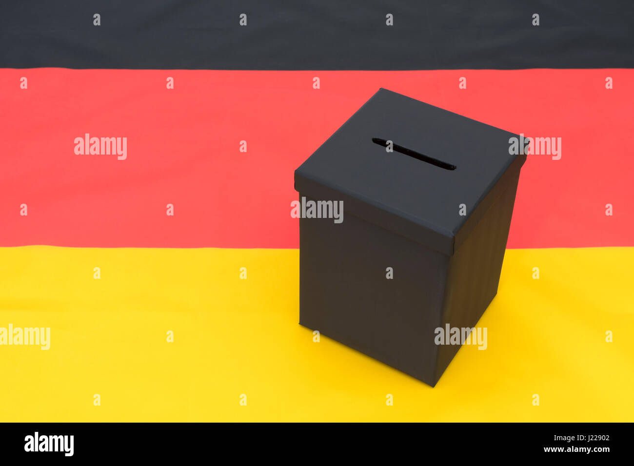 Black ballot box set against German flag - visual metaphor for German ...