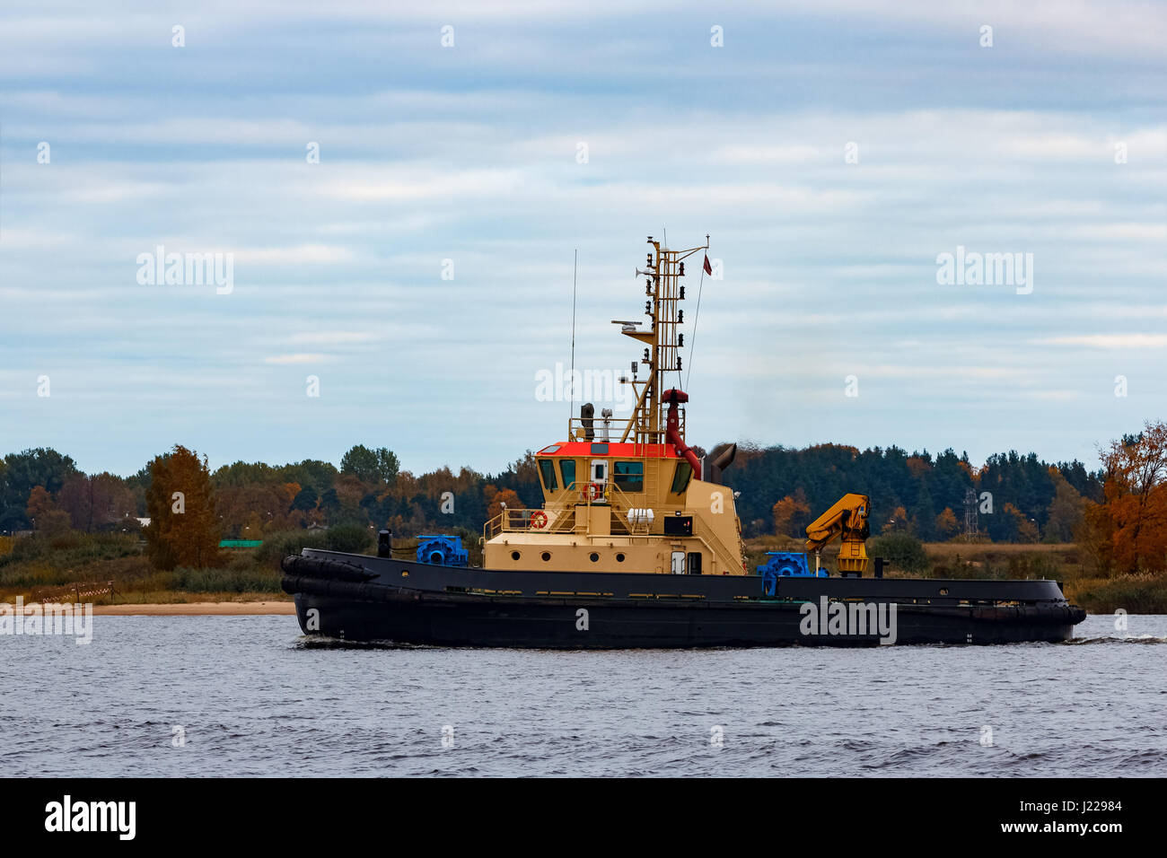 Tug ship in the cargo port of Riga, Europe Stock Photo - Alamy