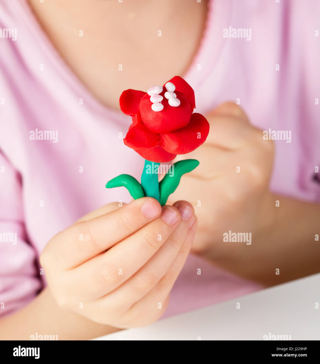 Child hands playing with colorful clay Stock Photo - Alamy