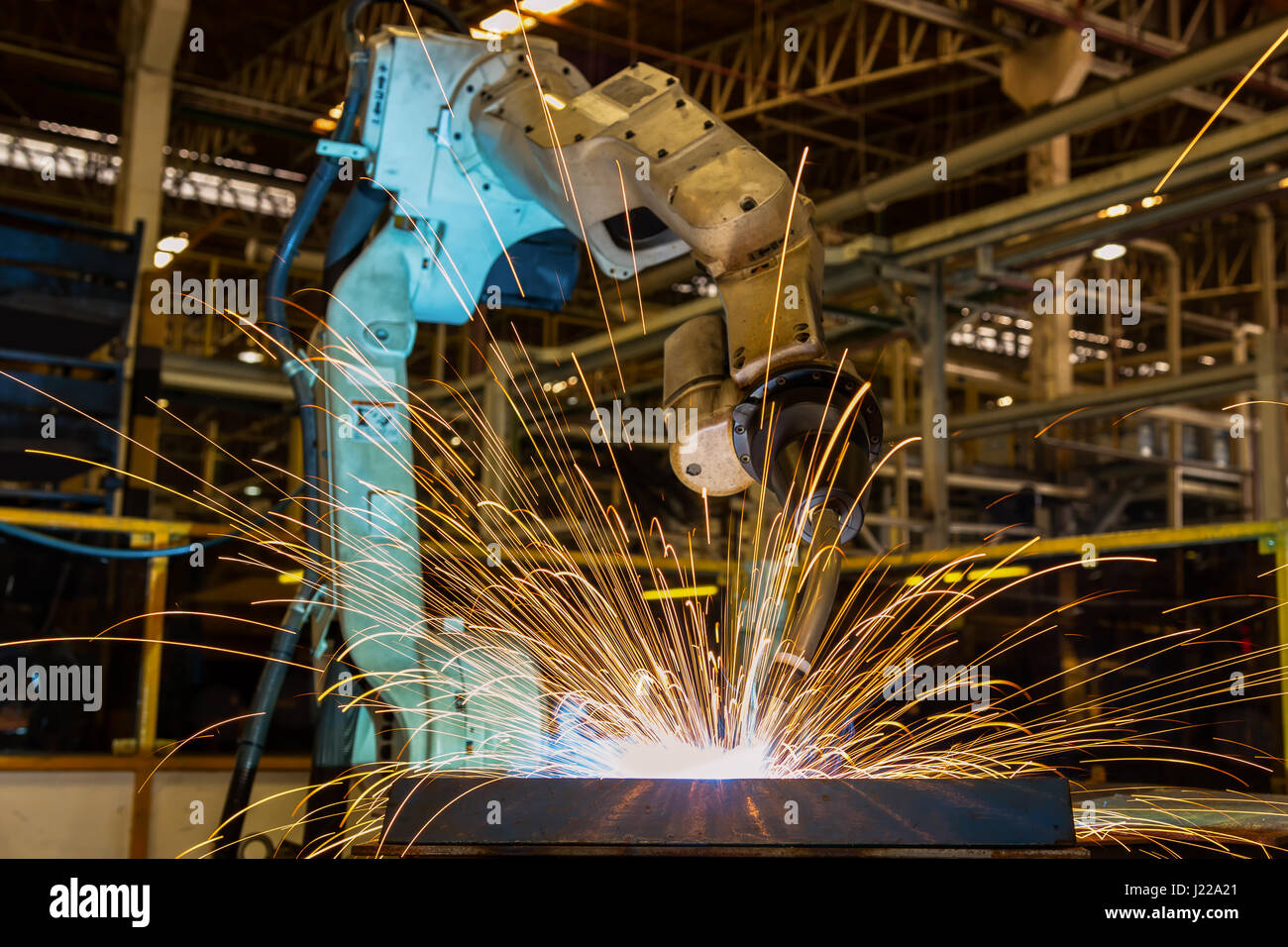Movement of robot welding in factory Stock Photo - Alamy