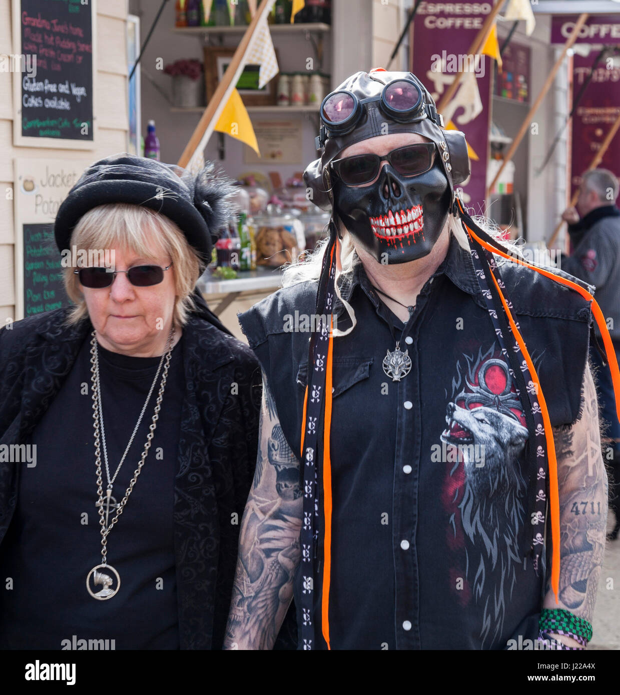 A man and woman pose for photos at the Whitby Goth celebrations in ...