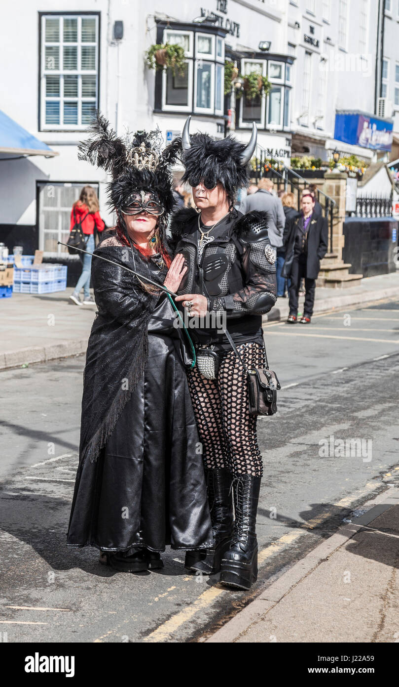 A man and woman pose for photos at the Whitby Goth celebrations in ...