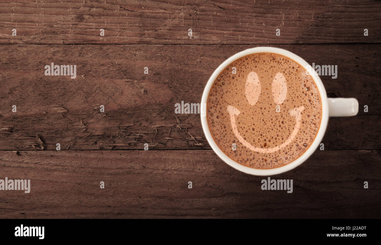 Smiley face on latte froth Stock Photo - Alamy