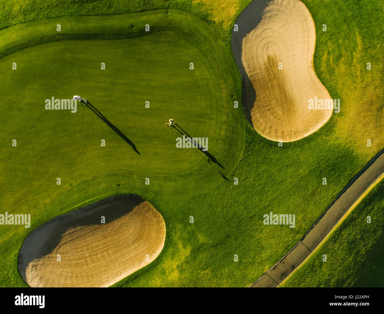 Golf course top view with players. Aerial view of golfers on putting ...