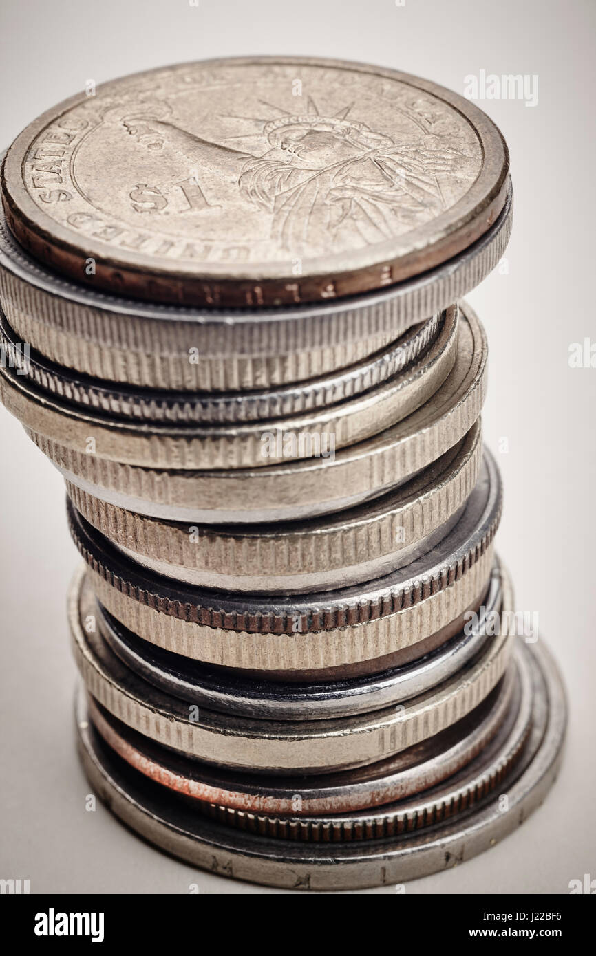 Different kinds of coins over a white background. Macro detail ...