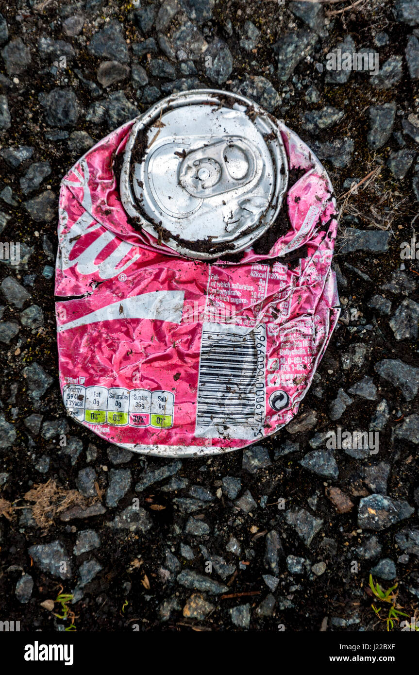 Crushed Coca cola Coke fizzy drink can tin on road faded colour Stock ...