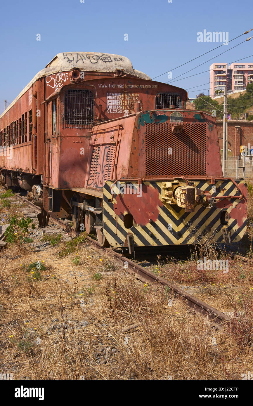 Rusting train engine on an abandoned railway track on the coast of the ...