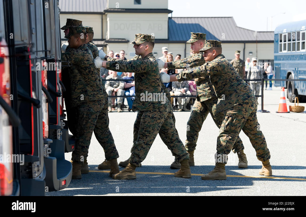 A U.S. Marine Corps carry team stands by after placing a transfer case ...