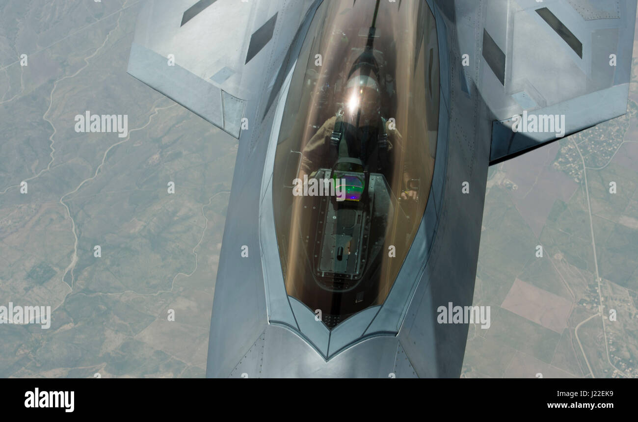 A U.S. Air Force F-22 Raptor pilot maneuvers his plane into position ...