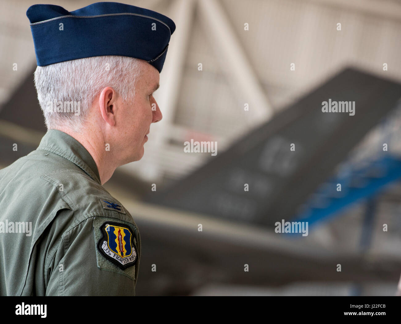 A 33rd Fighter Wing colonel stands at parade rest prior to the wing’s ...