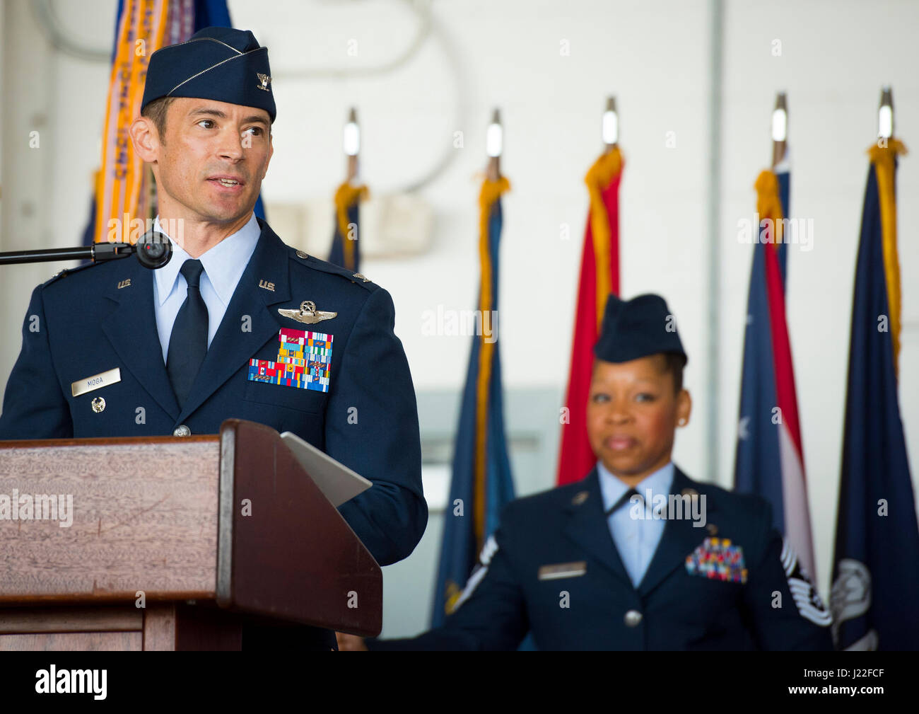 Col. Paul Moga speaks to the crowd and his Airmen after taking command ...