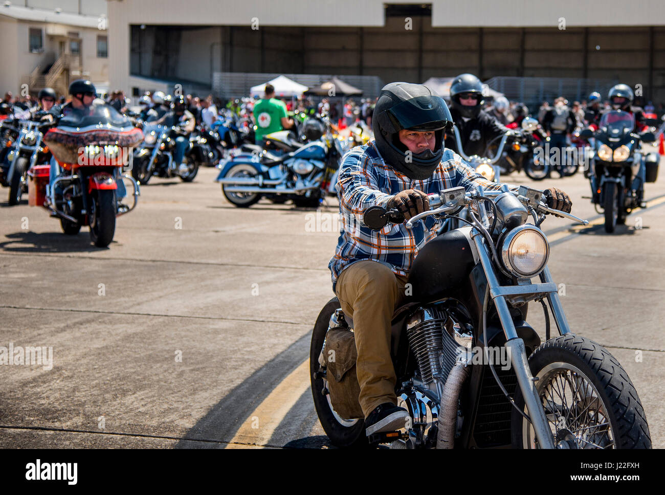 A biker rolls out after the annual motorcycle safety rally at Eglin Air ...