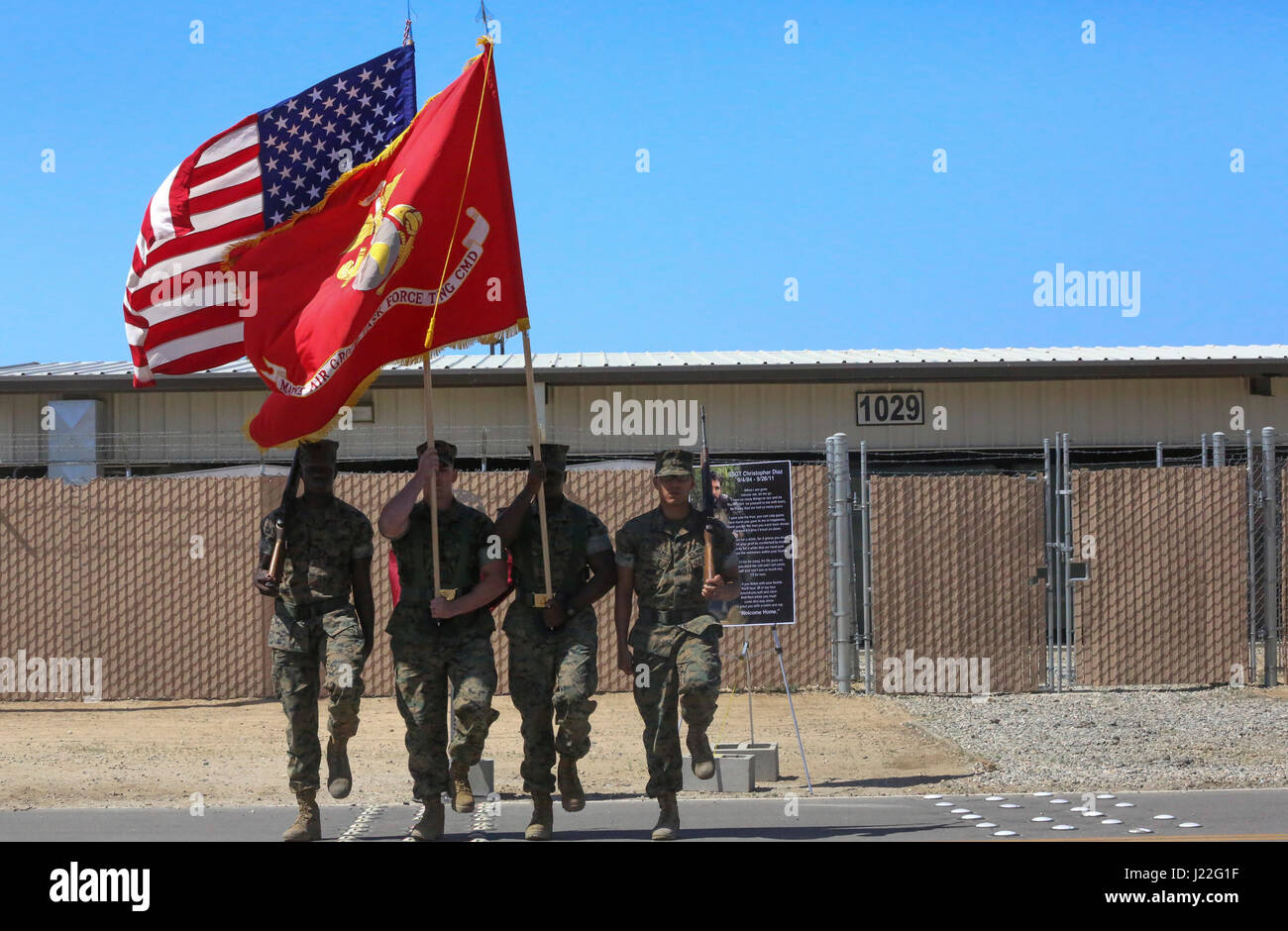 The Combat Center Color Guard prepares to present the National and ...