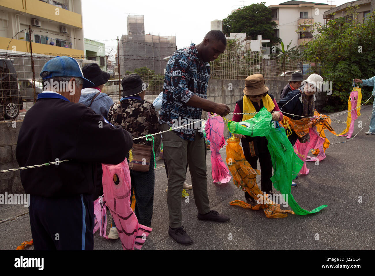 URASOE, OKINAWA, Japan— Lance Cpl. Daron Bush Jr.helps tie carp ...