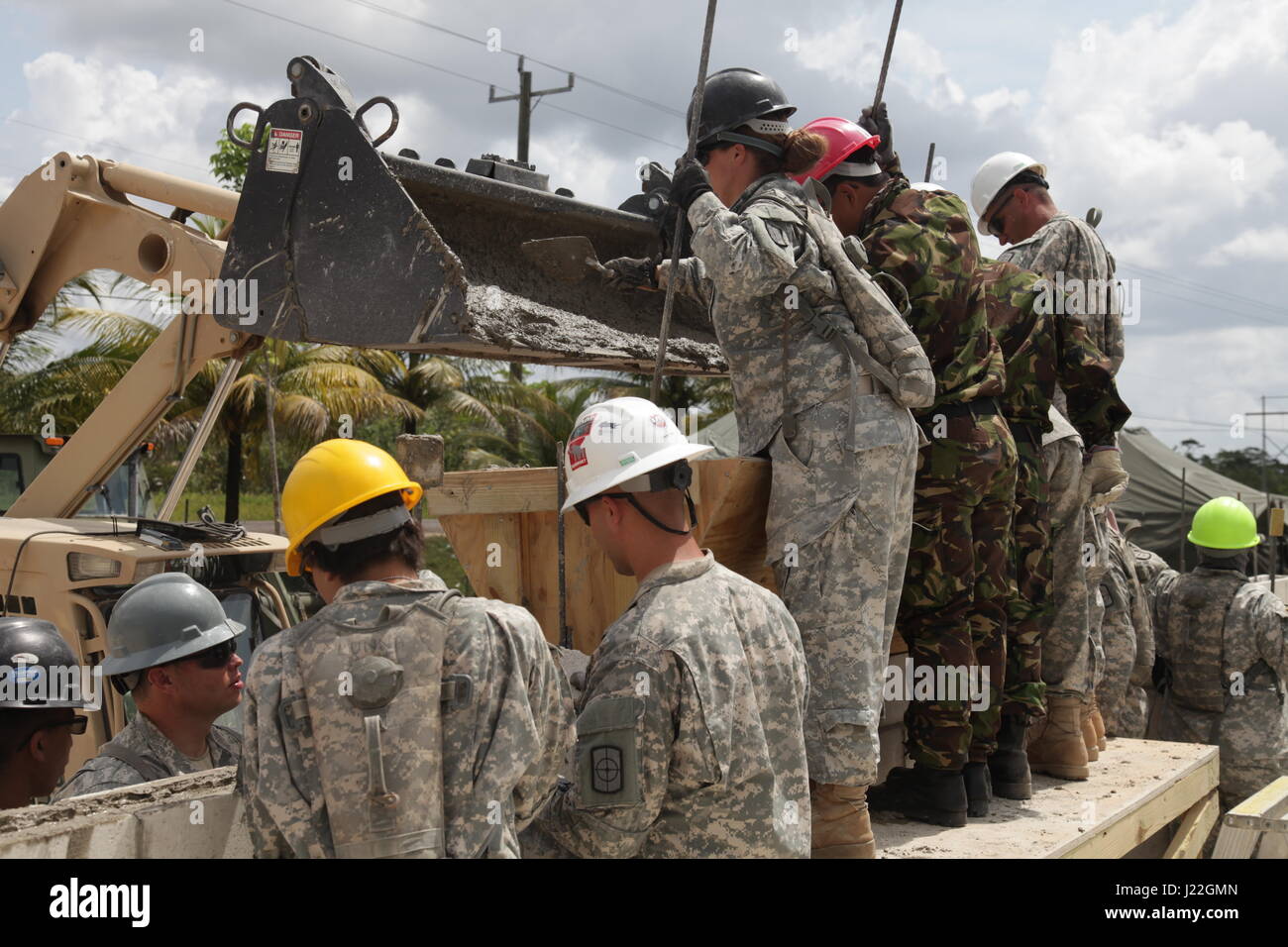 U.S. Army engineers and Belize Defense Force personnel construct a ...