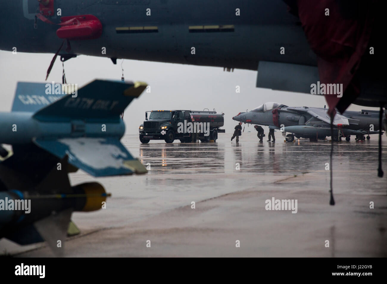 U.S. Marines with Marine Attack Squadron (VMA) 311 work on AV-8B ...