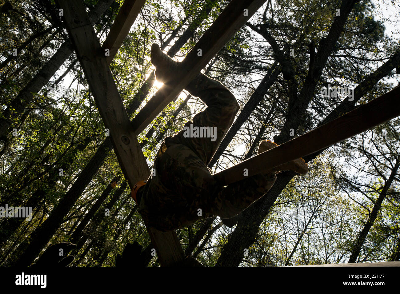 A Combat Cameraman manuevers through the weaver obstacle during the ...