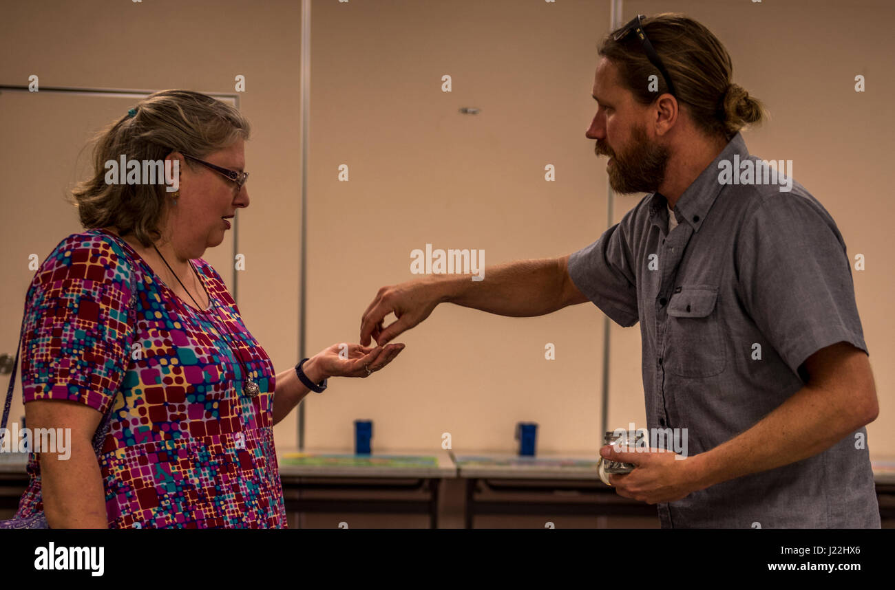Scott Schaad, an 18th Wing Environmental Office contractor, hands out ...