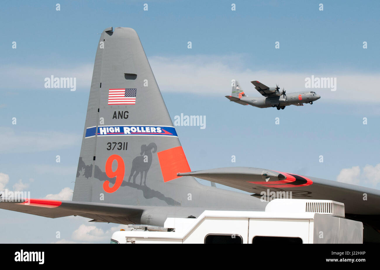A California Air National Guard C-130 aircraft flies by a Nevada Air ... A California Air National Guard C-130 aircraft flies by a Nevada Air ...