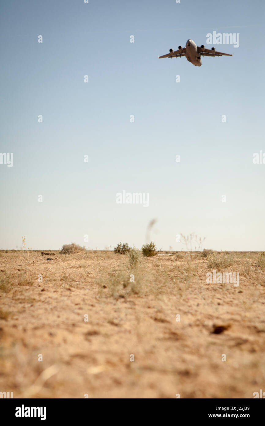 A U.S. Air Force C17 Globemaster III conducts low approaches with a ...