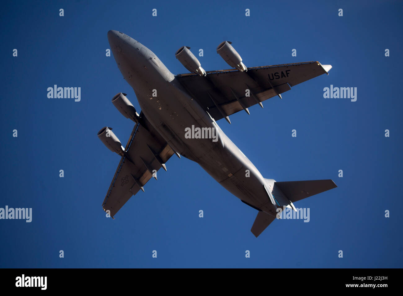 A U.S. Air Force C17 Globemaster III conducts low approaches with a ...