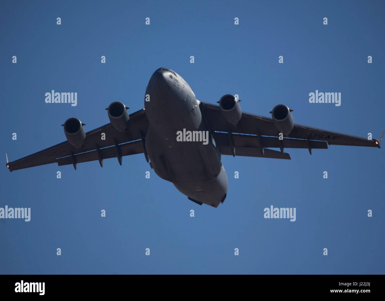 A U.S. Air Force C17 Globemaster III conducts low approaches with a ...