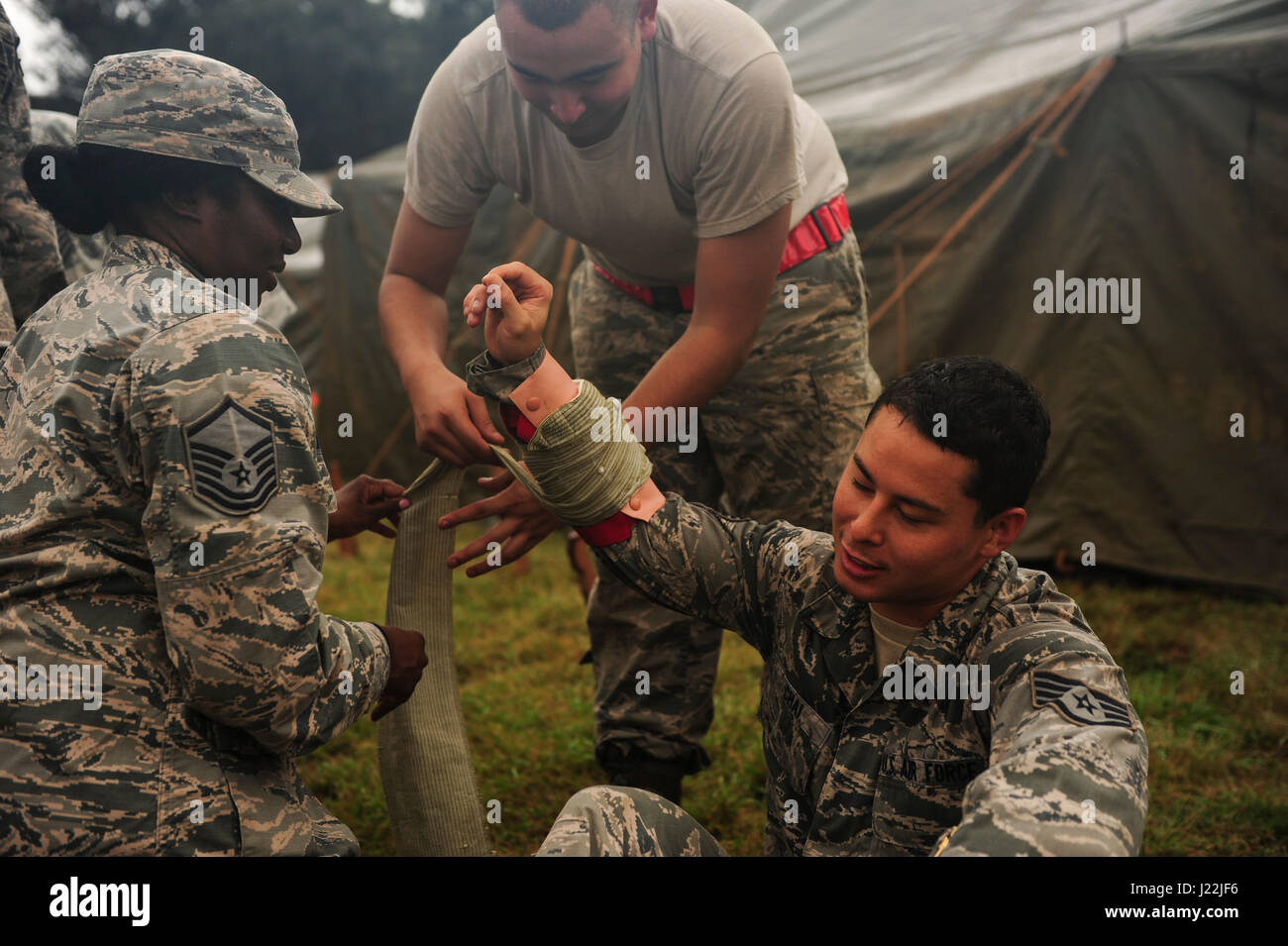 Airmen stationed at Hickam Field simulate self-aid buddy care on each ...