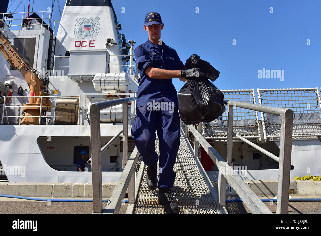The crew of the Coast Guard Cutter Steadfast offloads contraband during ...