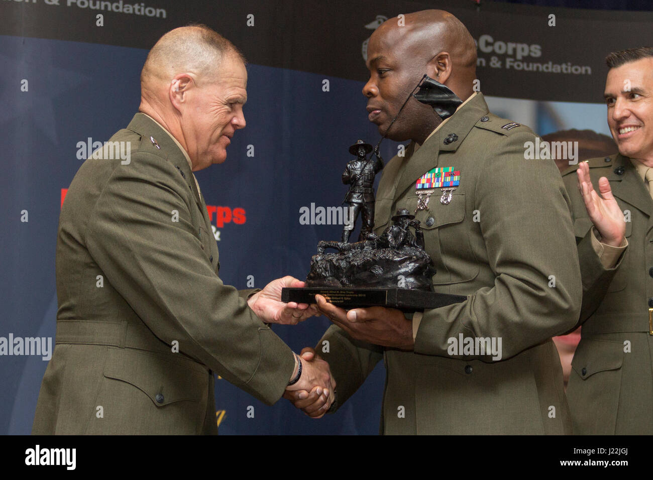 Commandant of the Marine Corps Gen. Robert B. Neller, left, shakes ...