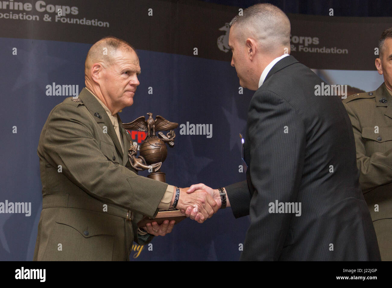 Commandant of the Marine Corps Gen. Robert B. Neller, left, shakes ...