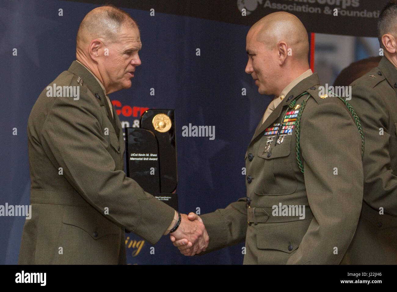 Commandant of the Marine Corps Gen. Robert B. Neller, left, shakes ...